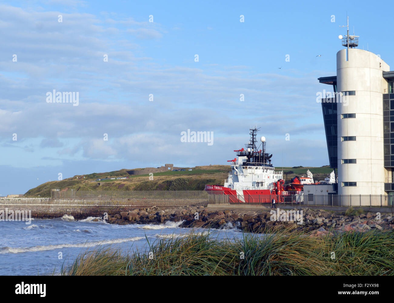 An oil rig supply vessel leaves Aberdeen Harbour past the Marine ...