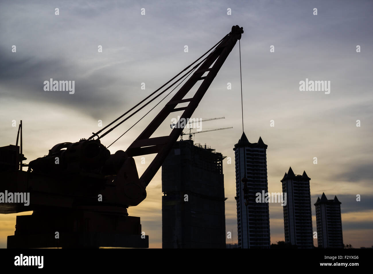 Crane on Building in Bangkok at sunset background Stock Photo - Alamy