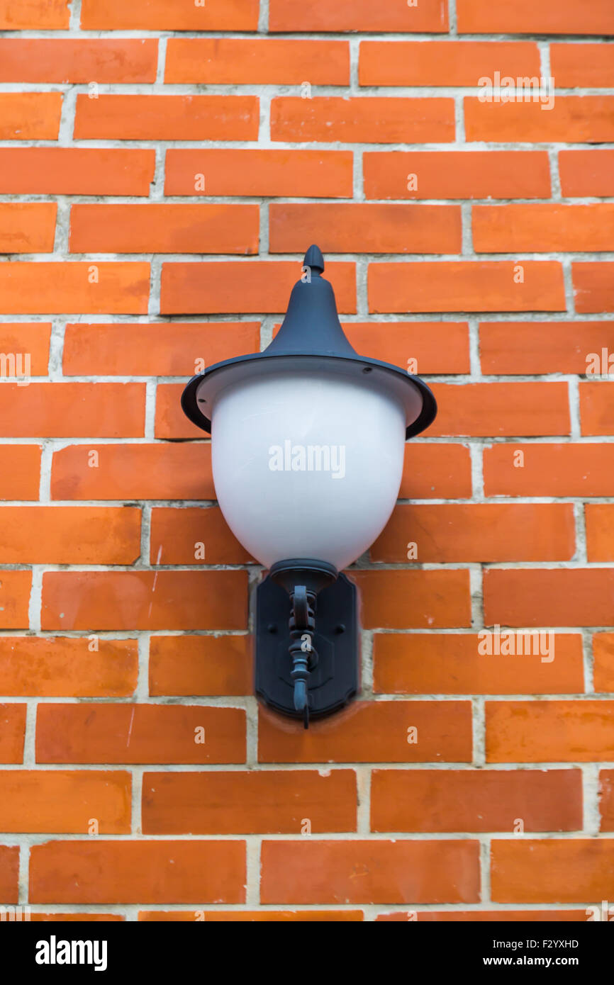 Lamp on a Brick Wall Stock Photo - Alamy