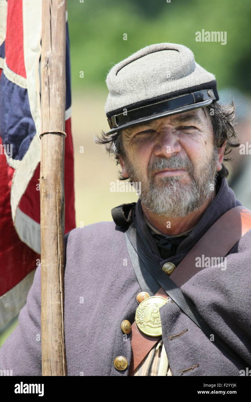 Confederate Civil War reenactor holding the Confederate flag Stock ...
