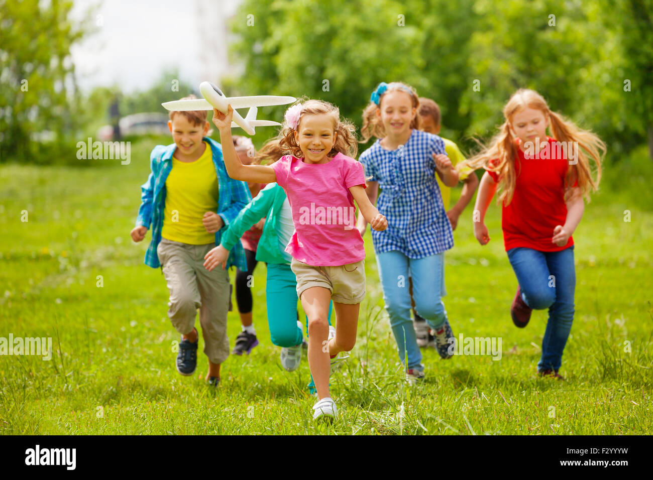 Children boy girl run behind hi-res stock photography and images - Alamy
