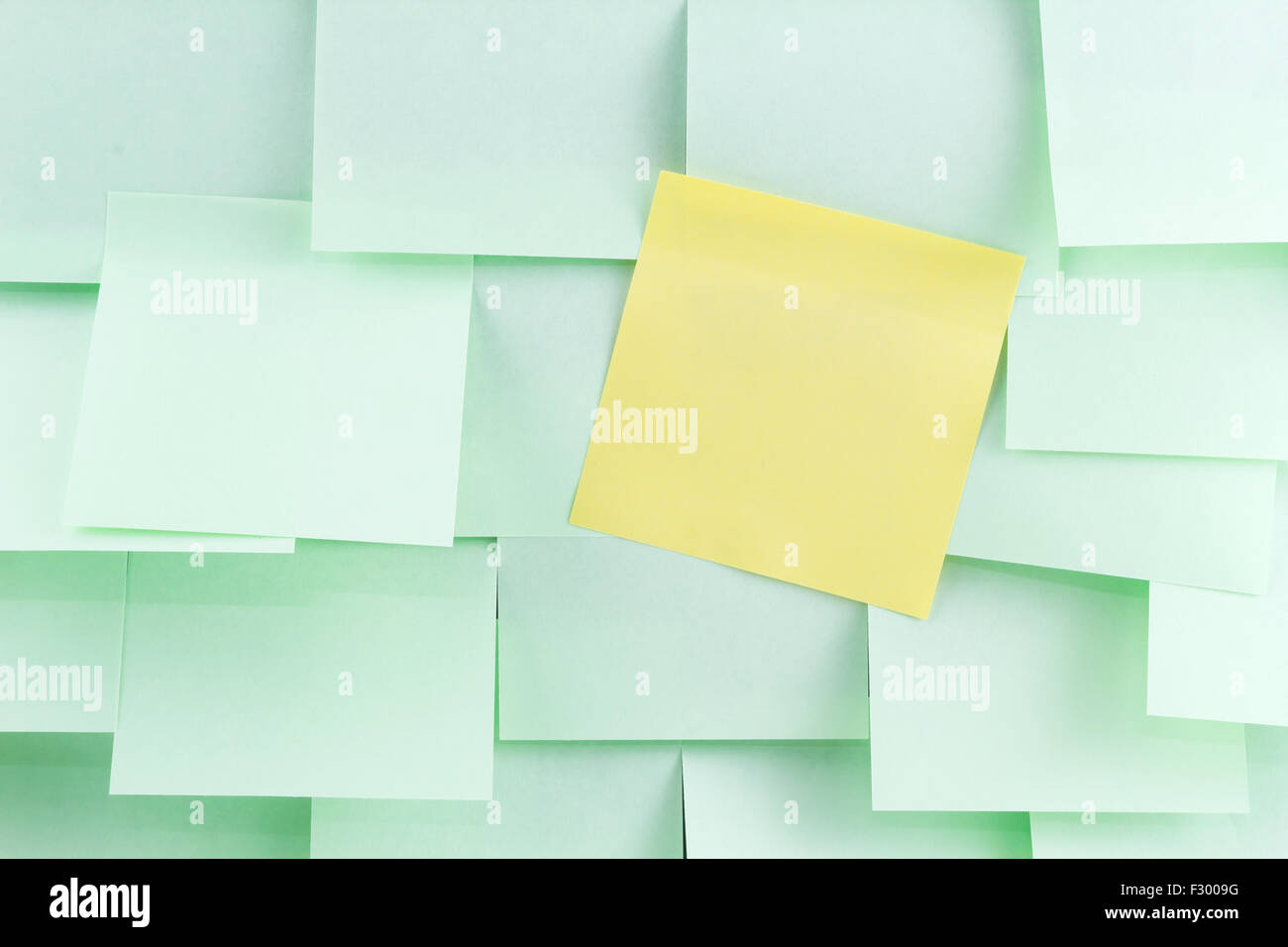 Green and yellow post-it note as a background Stock Photo - Alamy