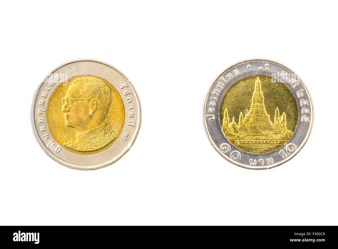 Thai ten baht coins on white background Stock Photo - Alamy