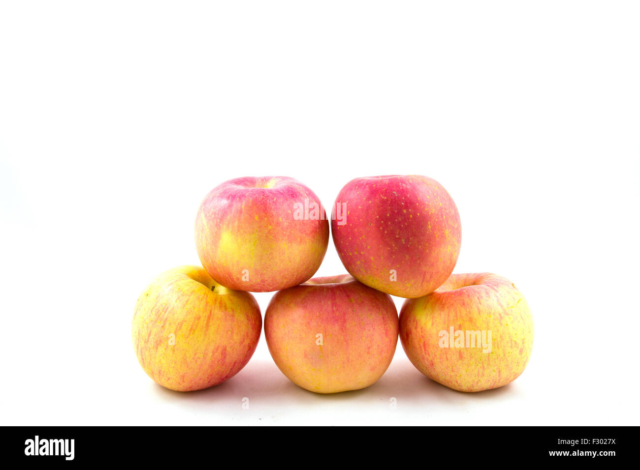 Five red apples on a white background Stock Photo - Alamy