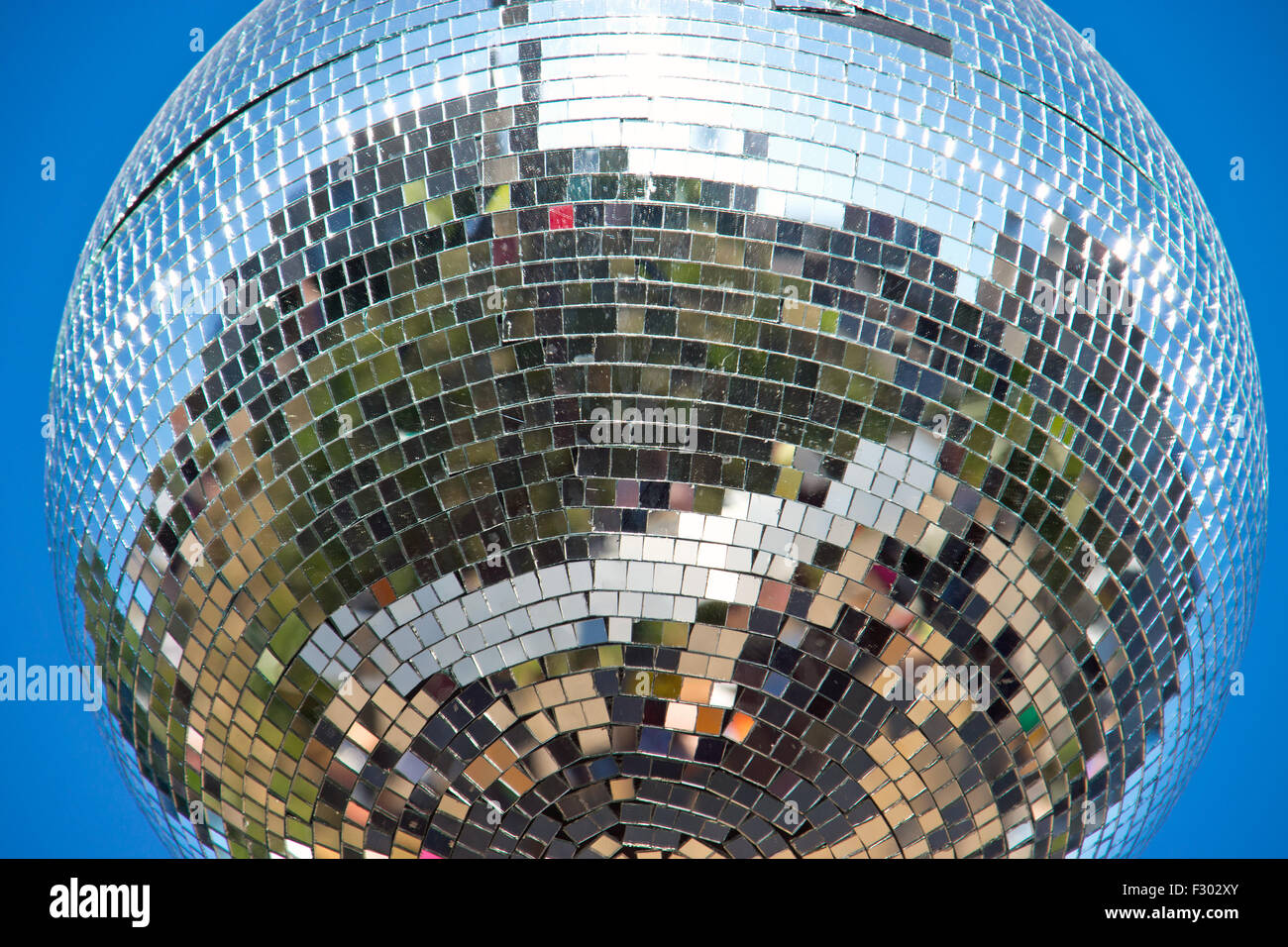 A disco ball hanging outdoors on a sunny day Stock Photo - Alamy