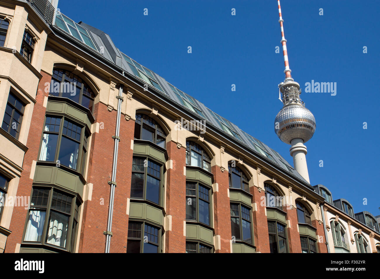 The famous television Tower at Alexanderplatz in Berlin behind an old ...