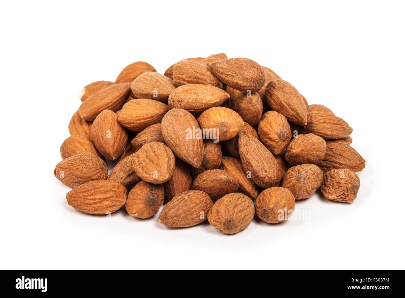 A pile of almonds isolated Stock Photo - Alamy