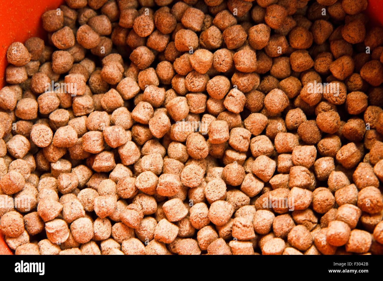Pellet fish food Stock Photo - Alamy
