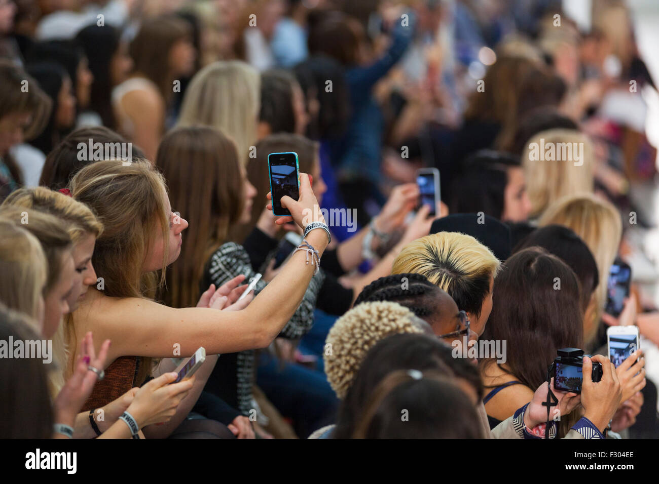 London, UK, 26th September 2015. Fashion fans snap pictures at the ...