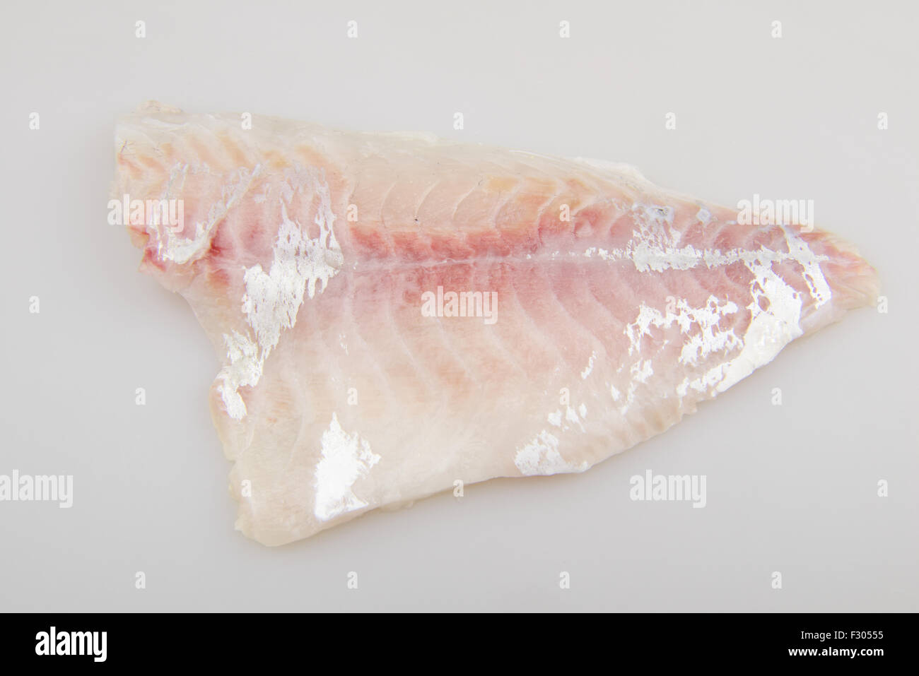 Seabream raw fish fillet Stock Photo - Alamy