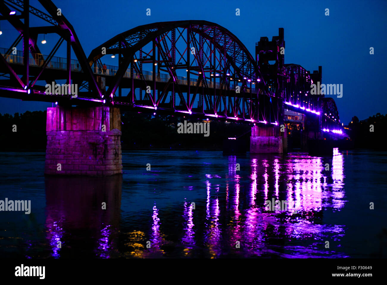 The 1899 Rock Island Railroad Bridge across the Arkansas River at night ...