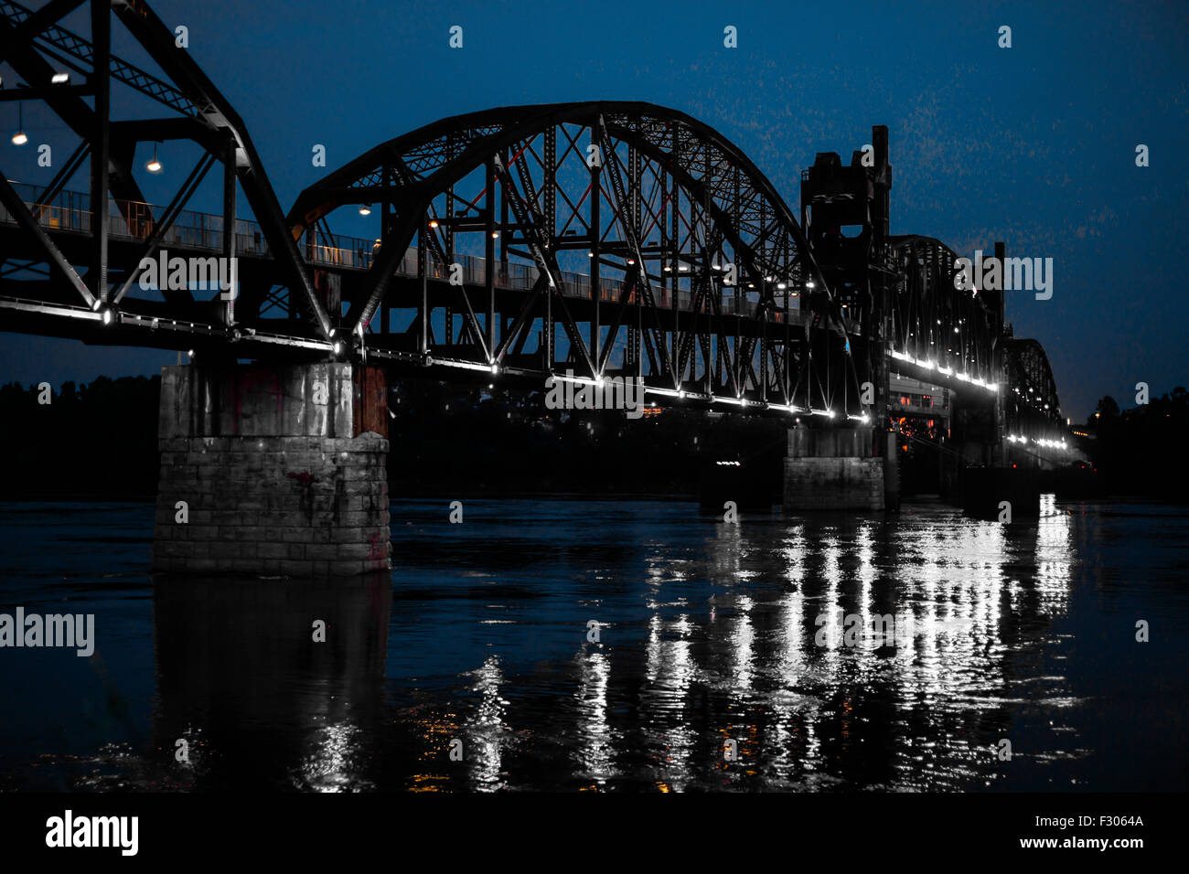 The 1899 Rock Island Railroad Bridge across the Arkansas River at night ...