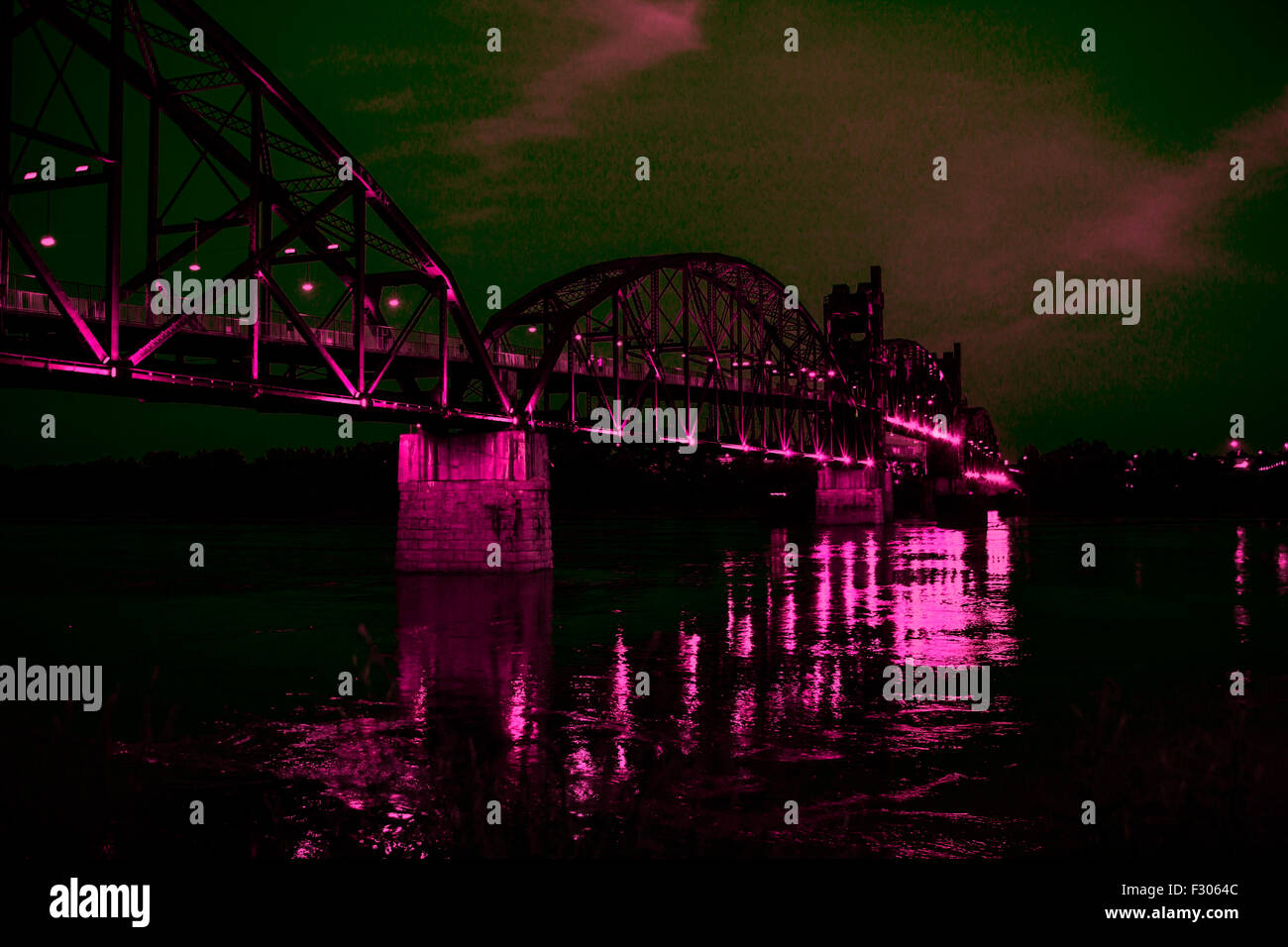 The 1899 Rock Island Railroad Bridge across the Arkansas River at night ...