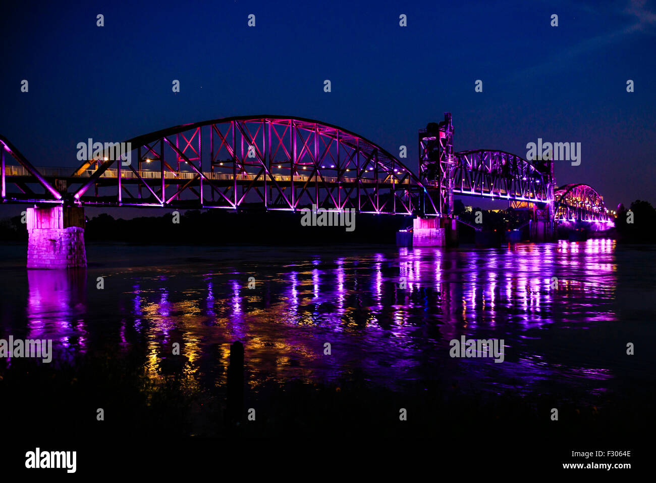The 1899 Rock Island Railroad Bridge across the Arkansas River at night ...