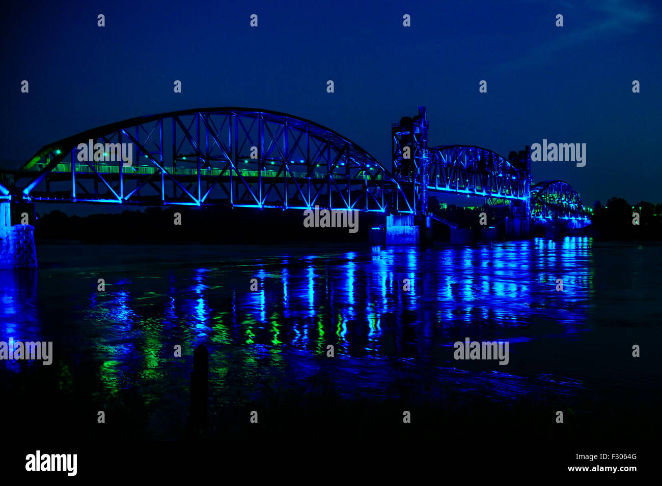The 1899 Rock Island Railroad Bridge across the Arkansas River at night ...