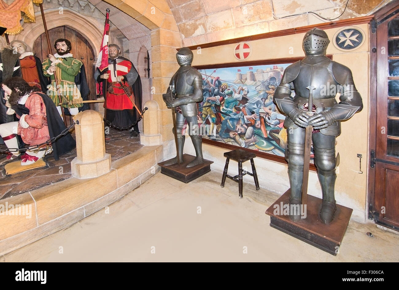 Knights in full armor on display inside a museum building in Mdina ...