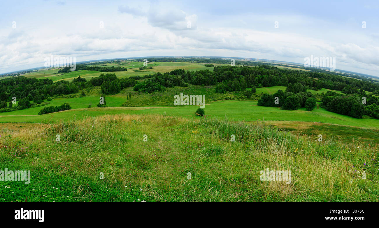 view from the hill on fields and the woods with footpaths Stock Photo ...