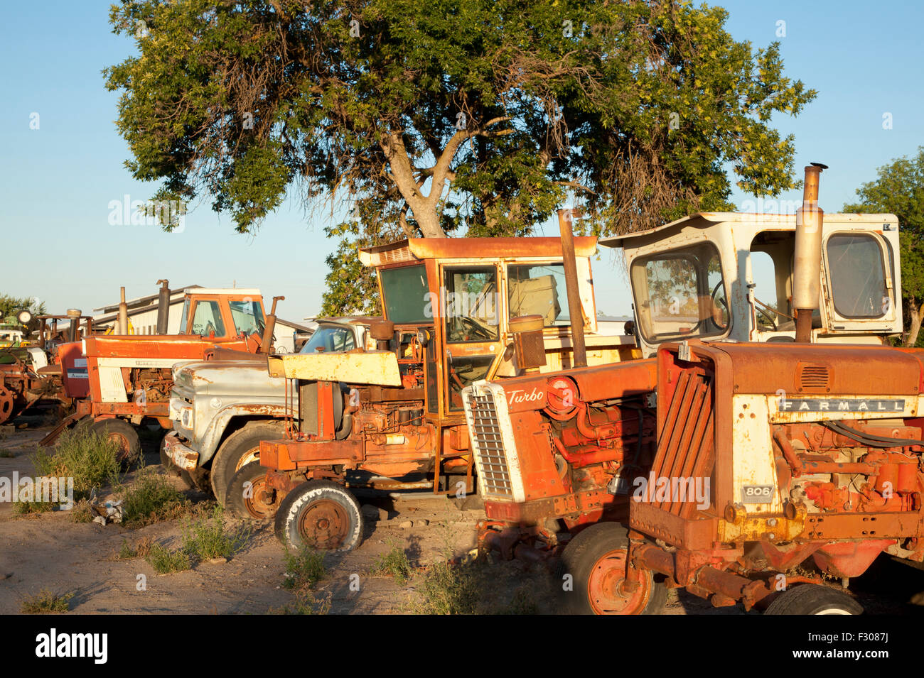 Rusted farm tractors in junkyard at sunset,US,2015 Stock Photo - Alamy