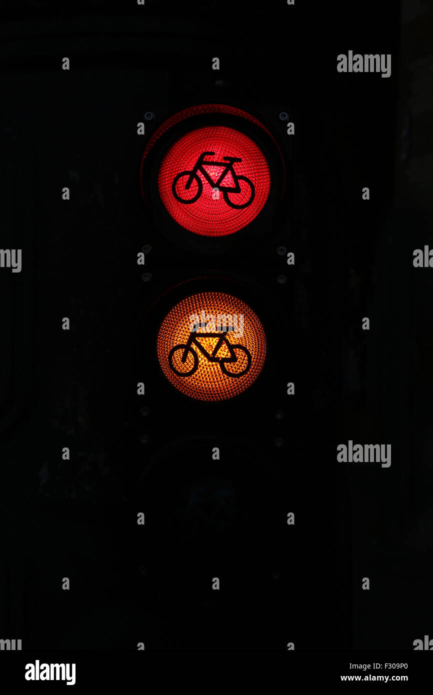 Red and orange colored traffic signs by night in the city Stock Photo ...