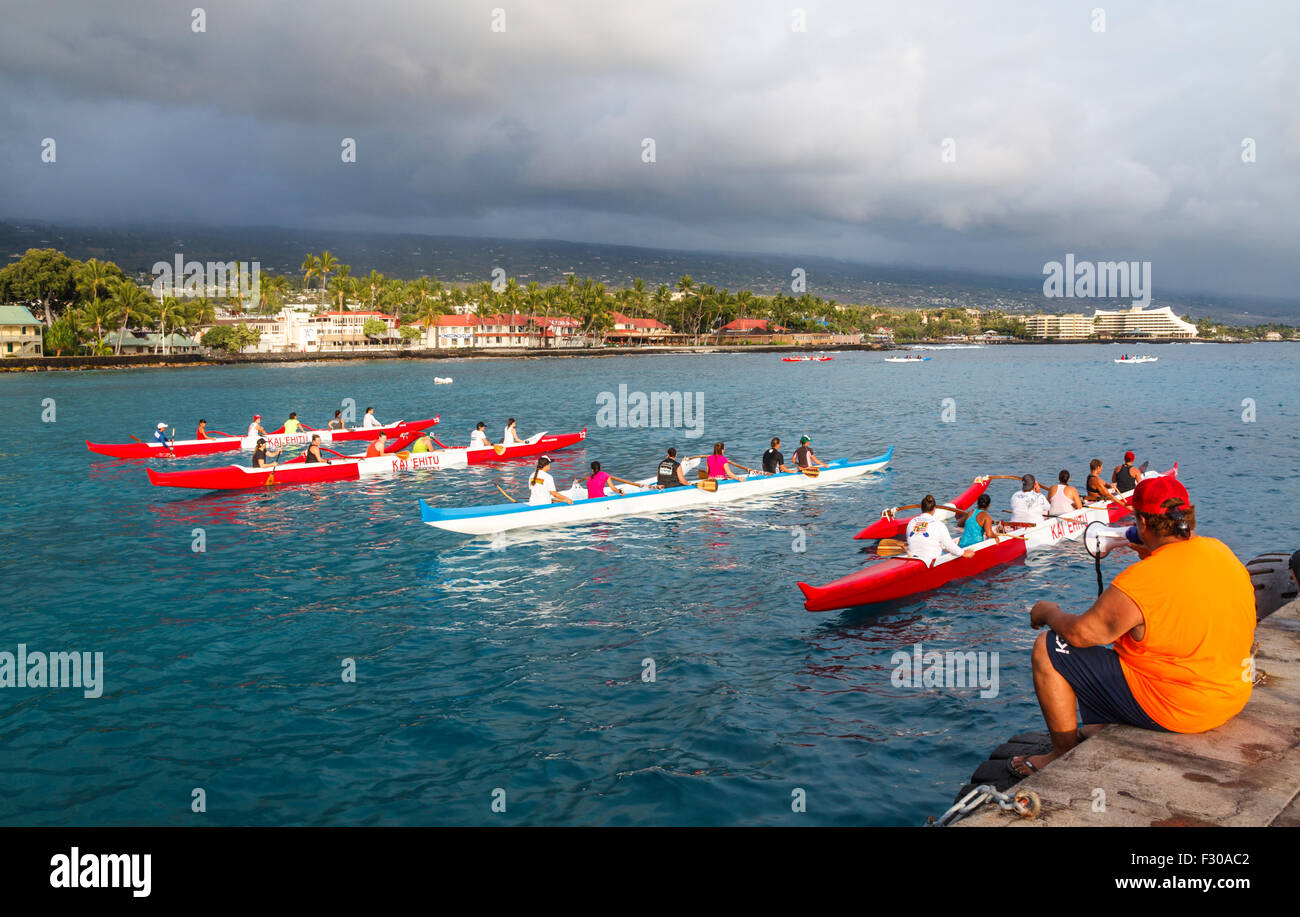 Coach on pier gives tips to outrigger canoe club members practicing in ...