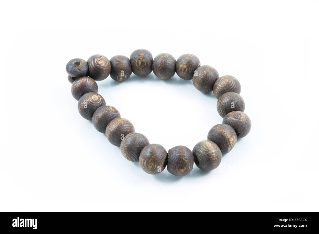 Wooden beads on white background Stock Photo - Alamy