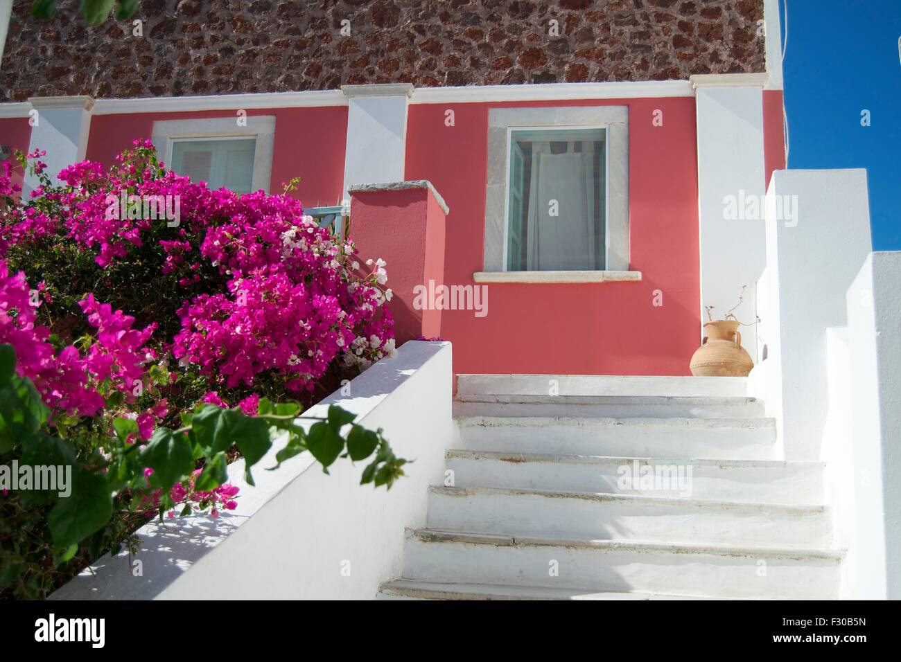 Traditional Greek house with flowers Stock Photo - Alamy