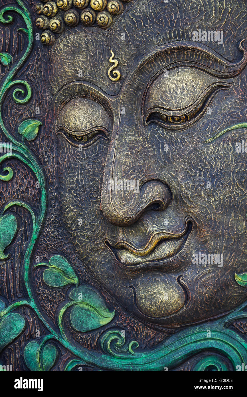 Beautiful buddha face carve background Stock Photo - Alamy