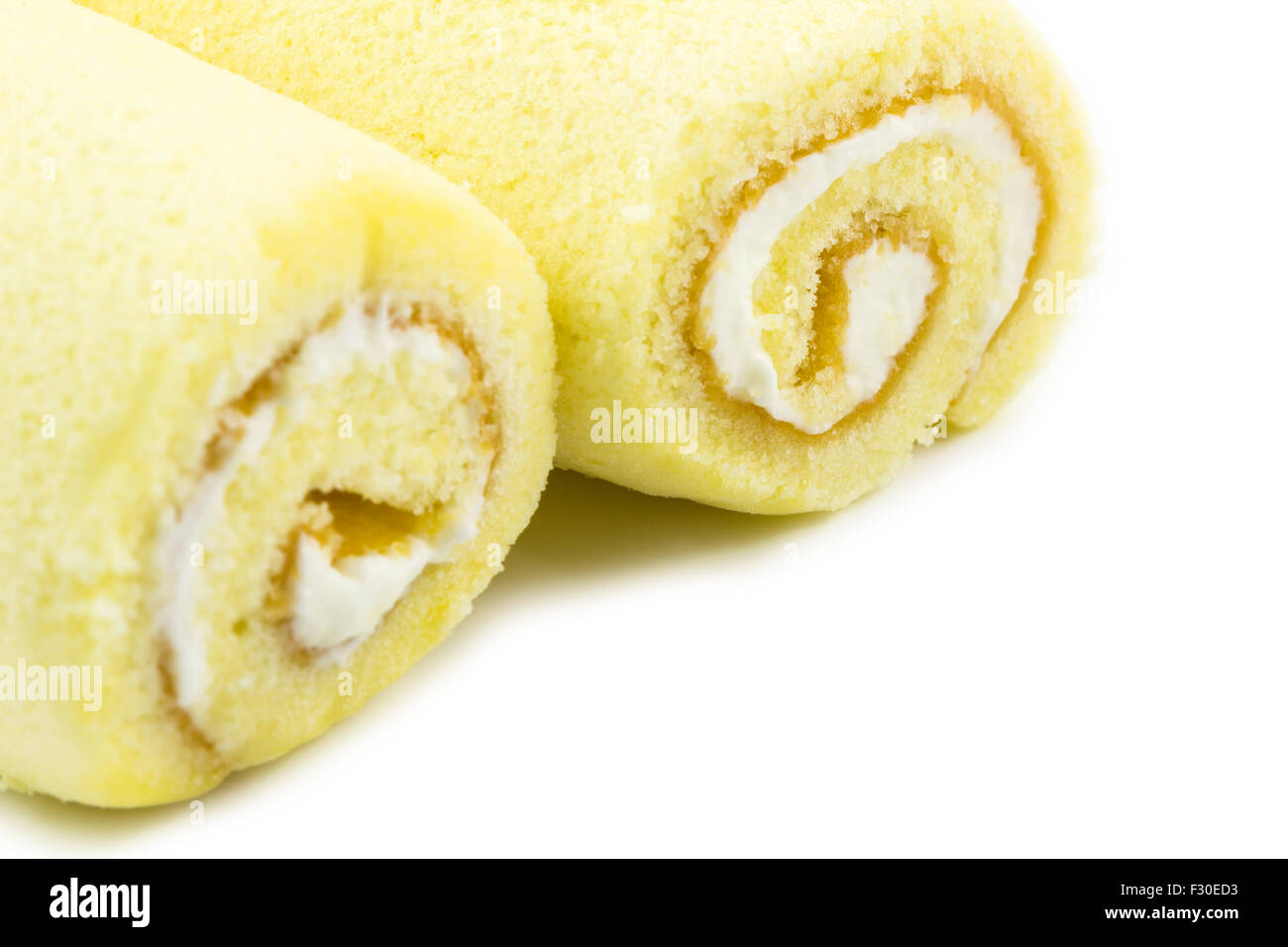 Jam roll cake with cream isolated on white background Stock Photo - Alamy