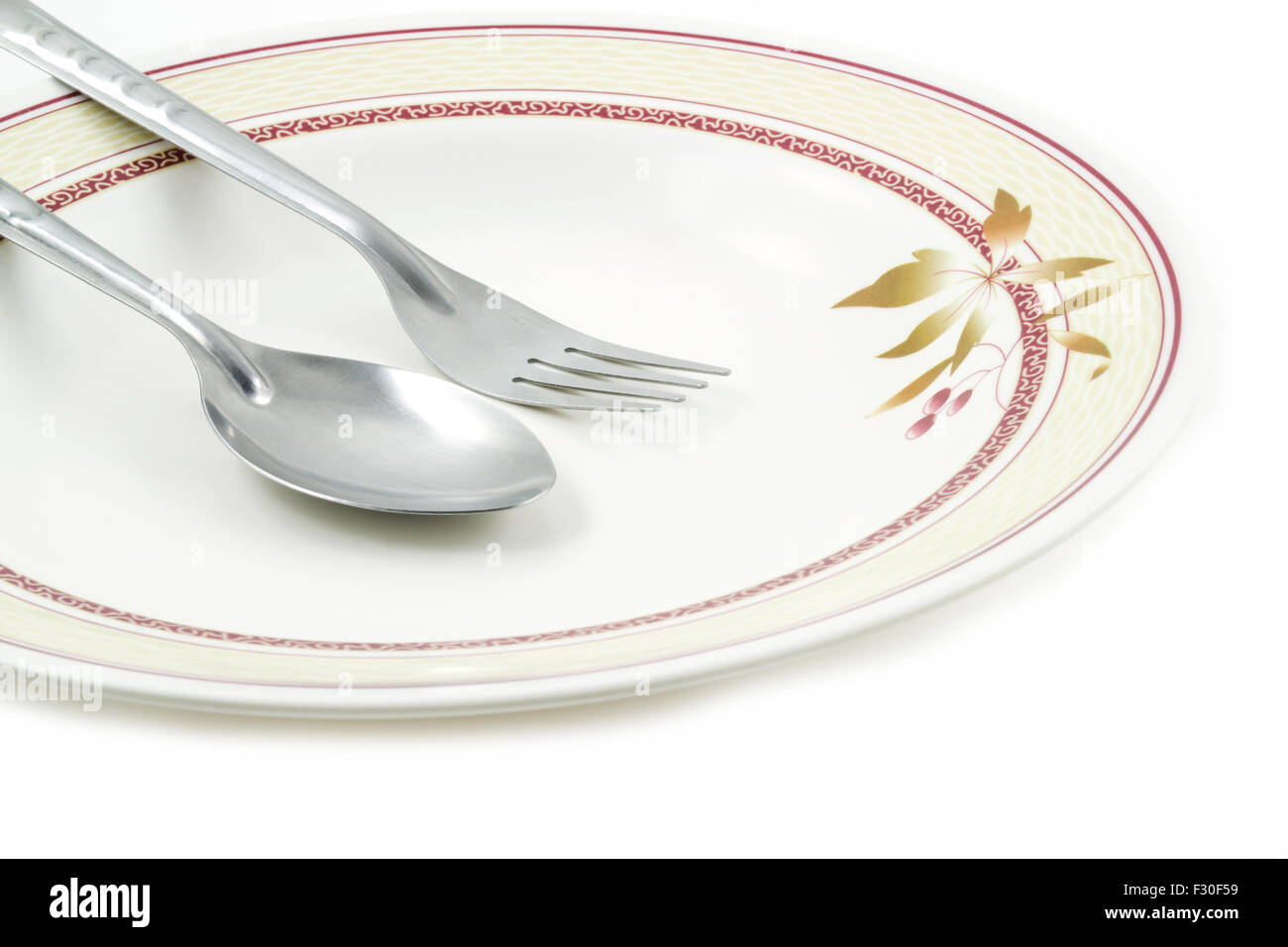 Empty dish spoon and fork on white background Stock Photo - Alamy