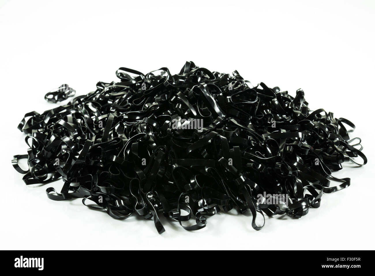 Black plastic band on white background Stock Photo - Alamy