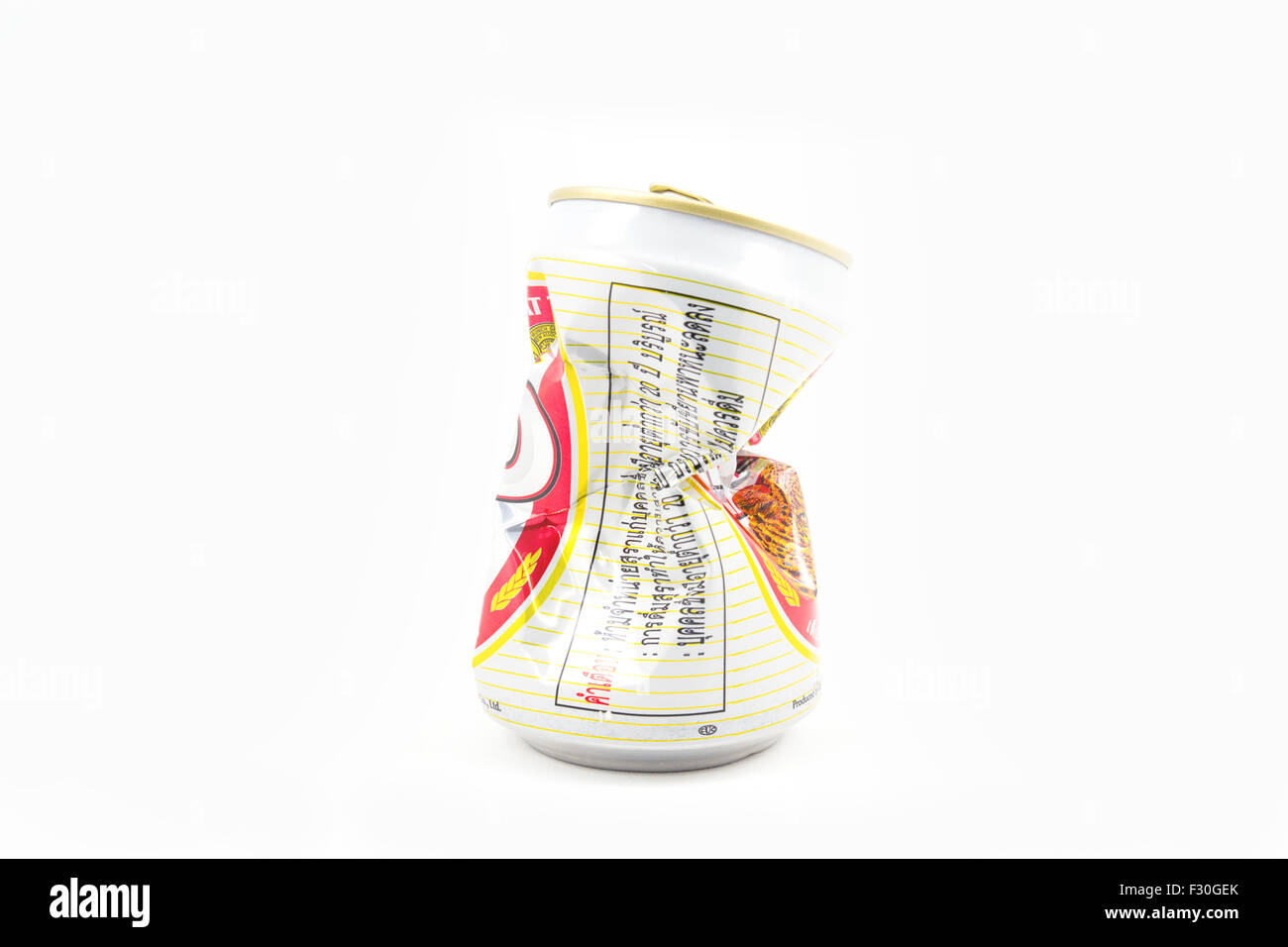 Pressed beer can in white background Stock Photo - Alamy