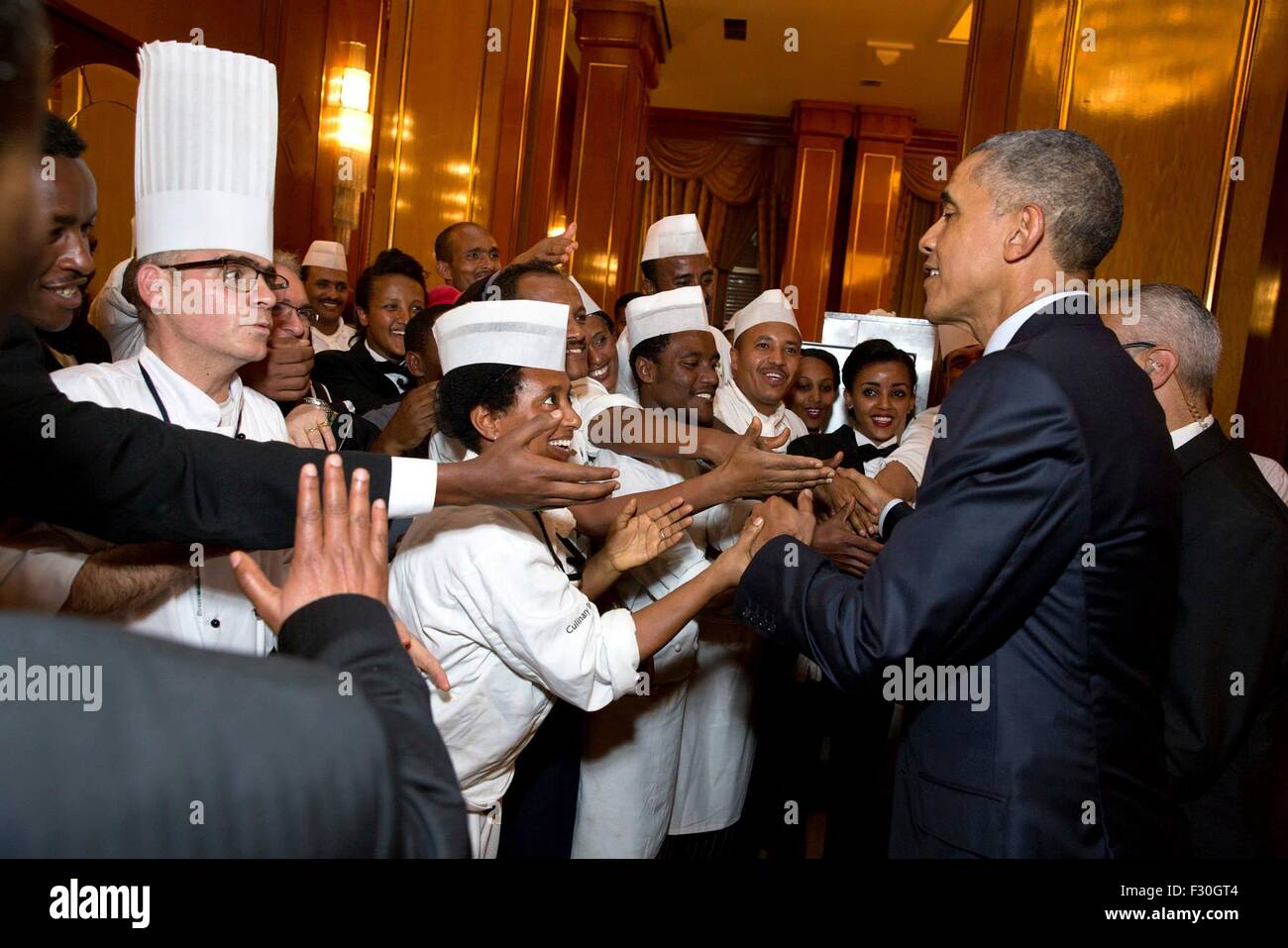 U.S. President Barack Obama greets the catering staff following the ...