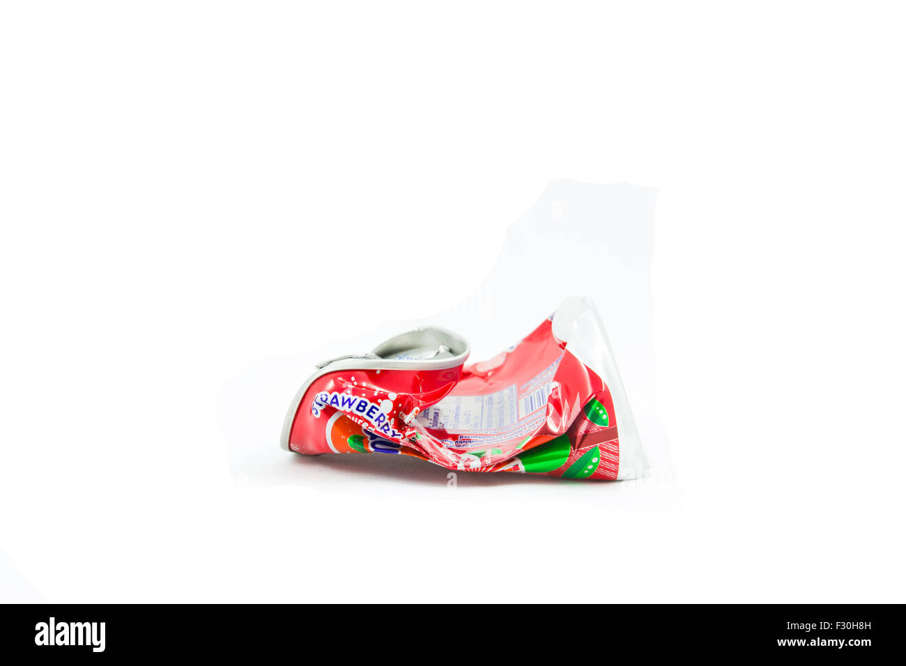 Pressed can in white background Stock Photo - Alamy