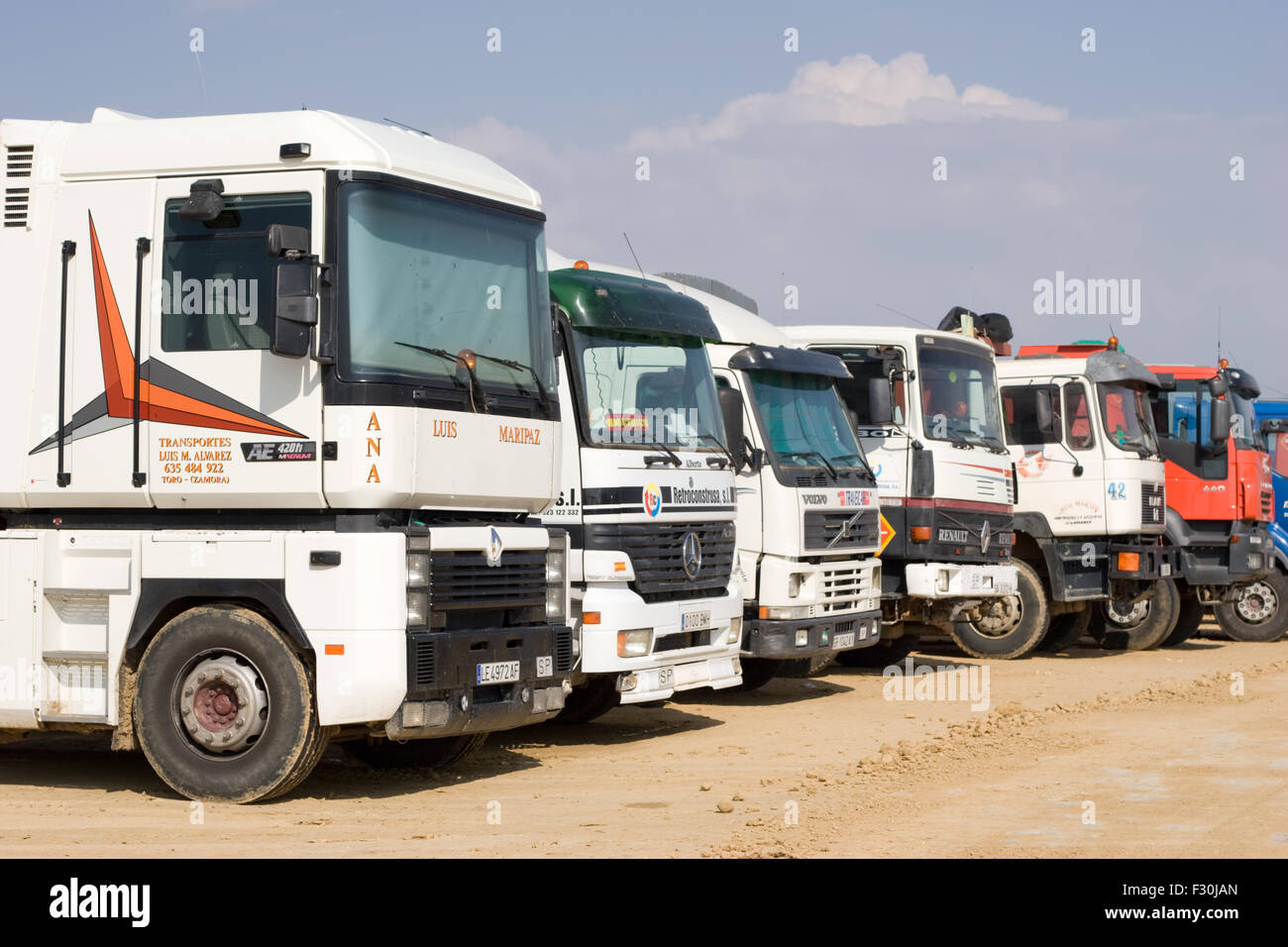 Construction truck in line Stock Photo - Alamy