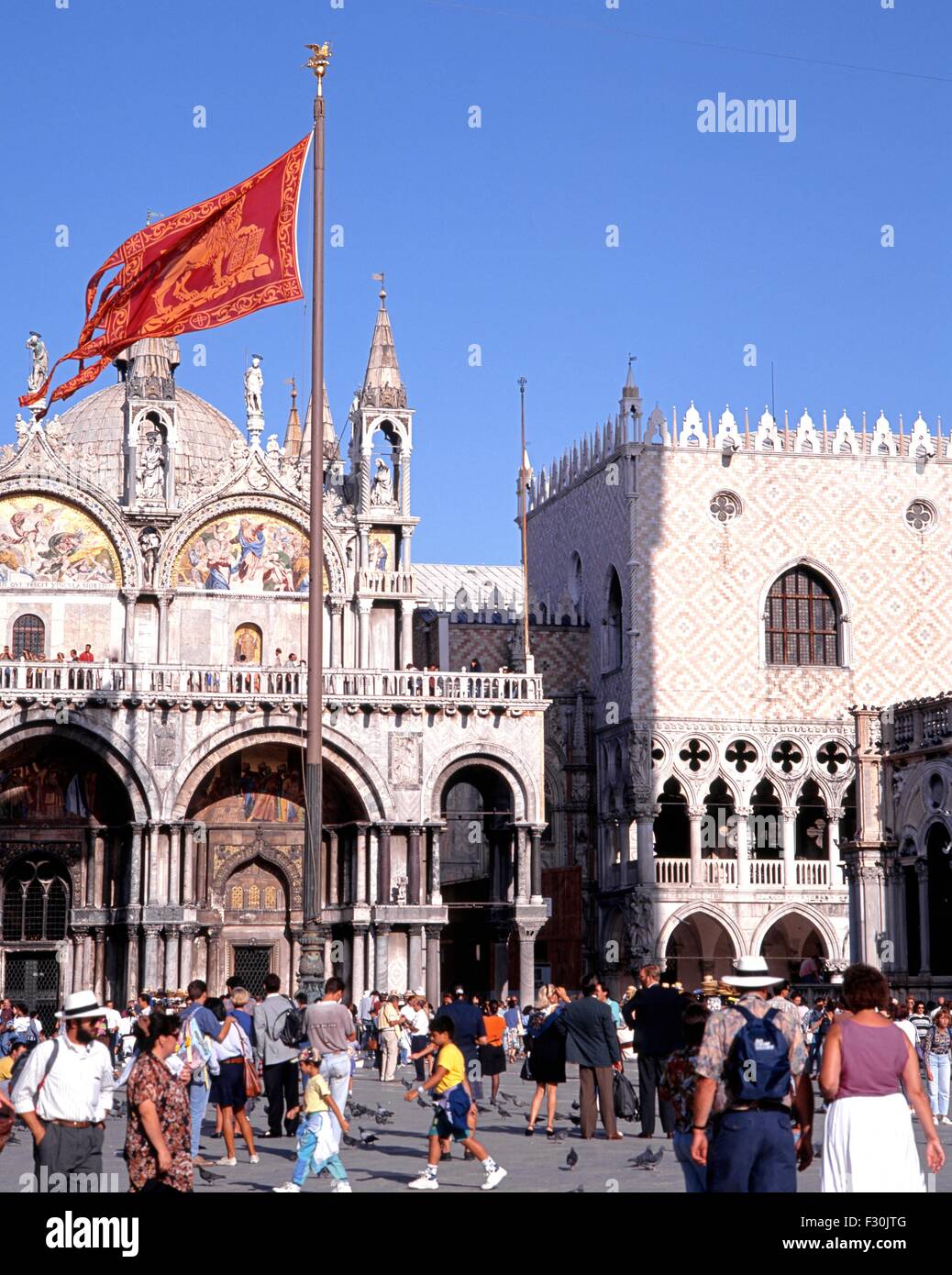 Part of St Marks Basilica and the Doges Palace with tourists in the ...