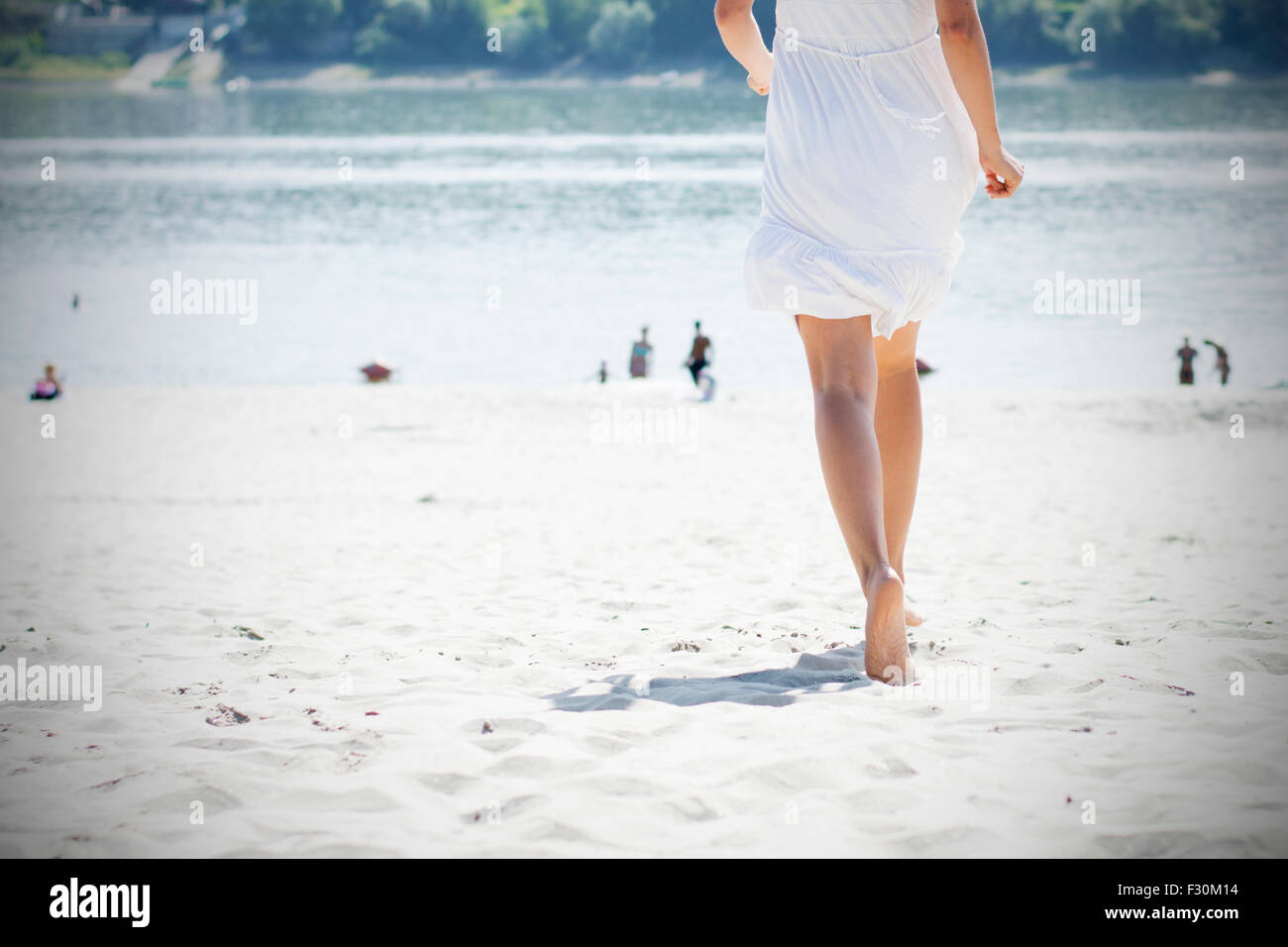 Barefoot woman white dress hi-res stock photography and images - Alamy