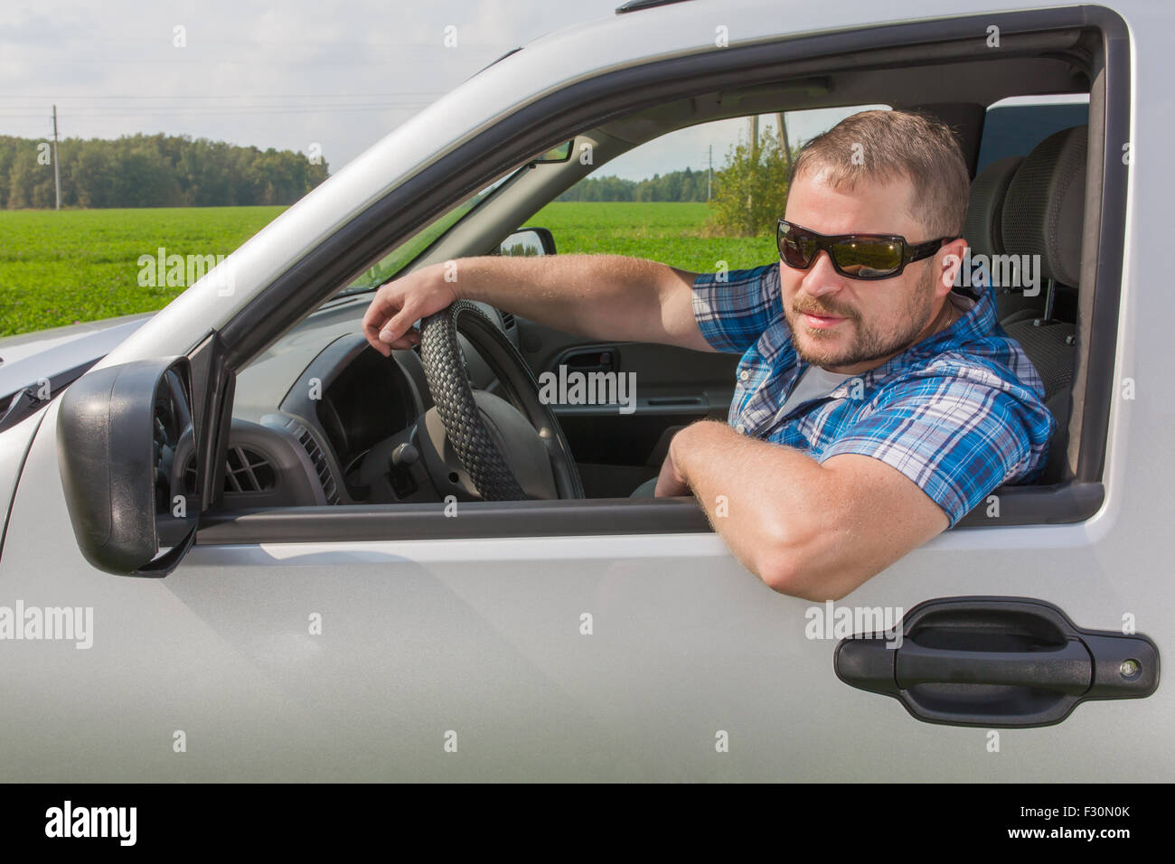Man driving car looking place hi-res stock photography and images - Alamy