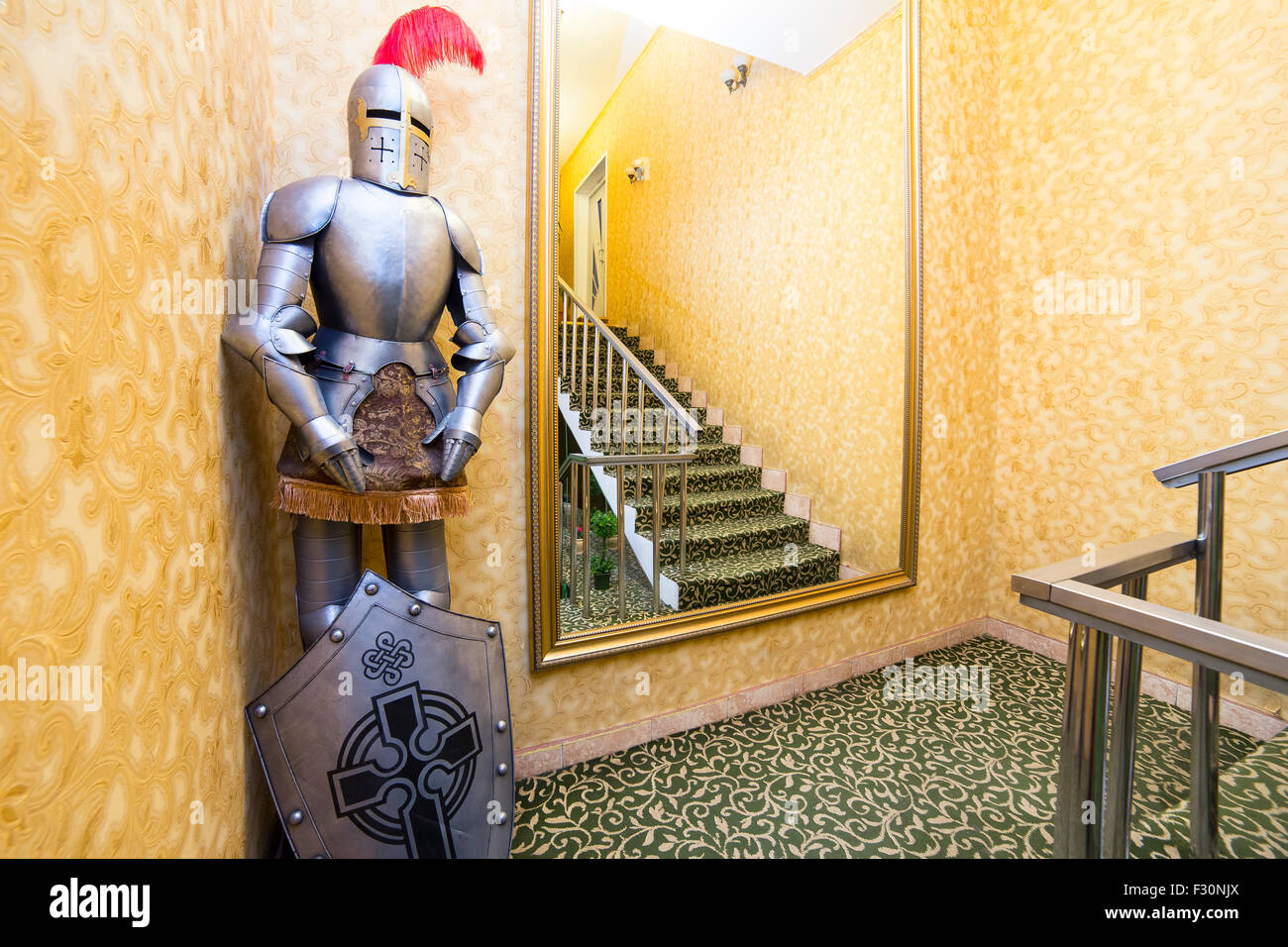 Knight's armor indoors near stair and the mirror Stock Photo - Alamy