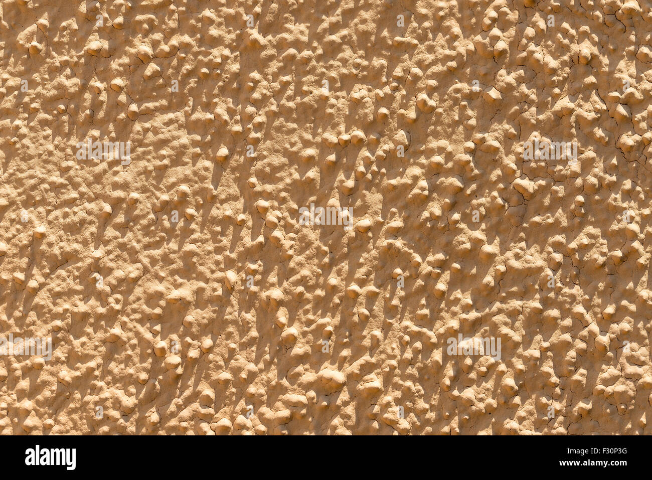 Ocher stucco wall to sunlight Stock Photo - Alamy