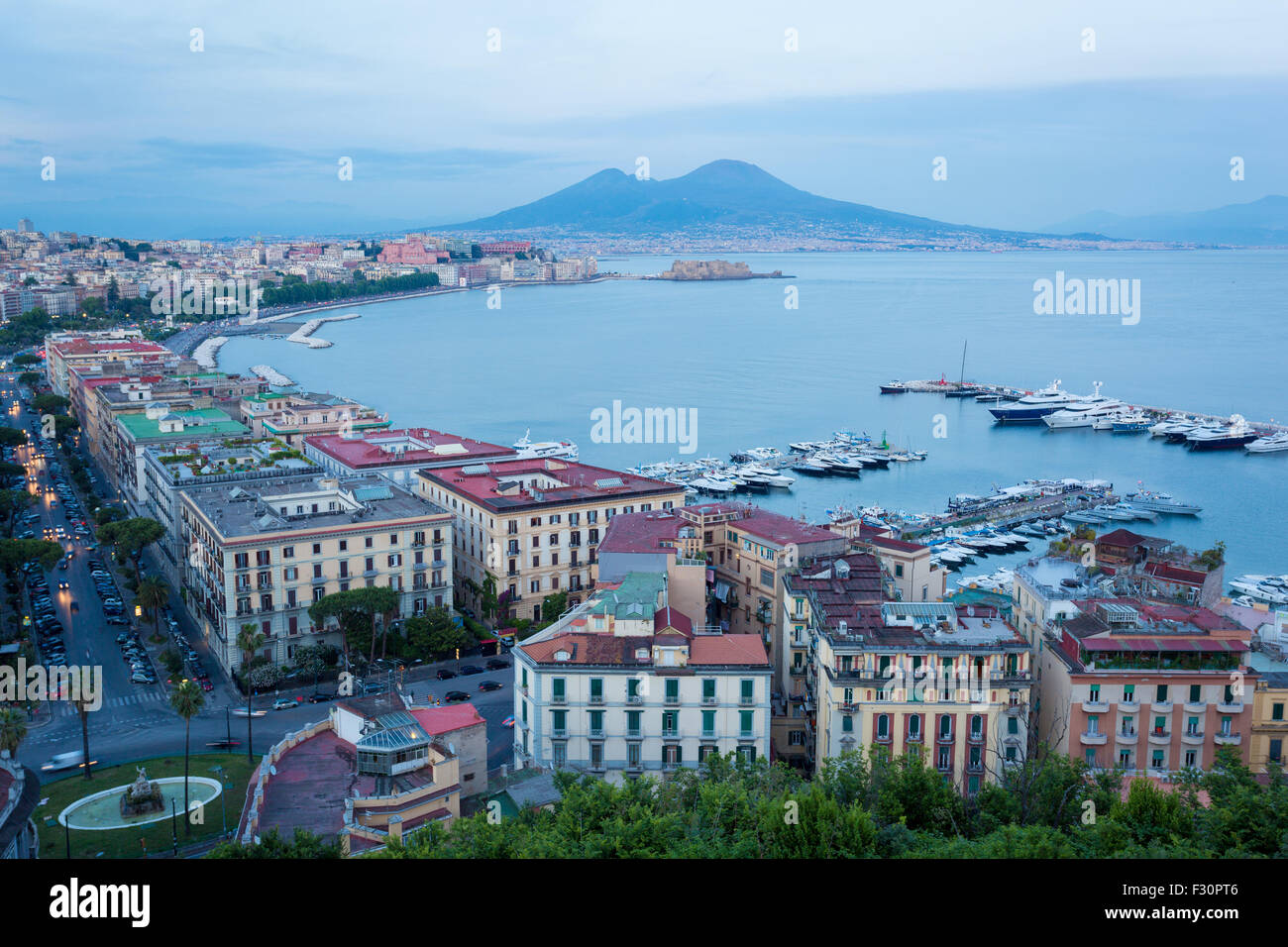 Naples, panoramic view of the city with city lights on and the gulf ...