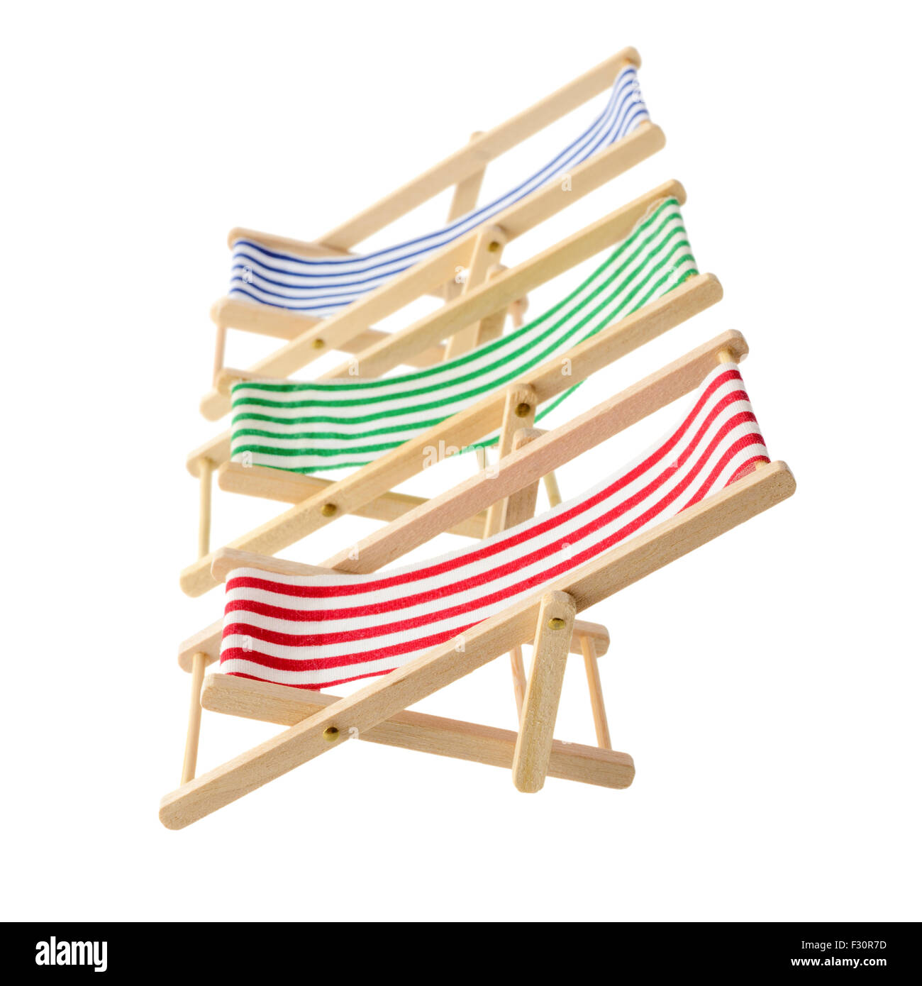 Isolated objects: group of wooden multicolored striped deck chairs ...