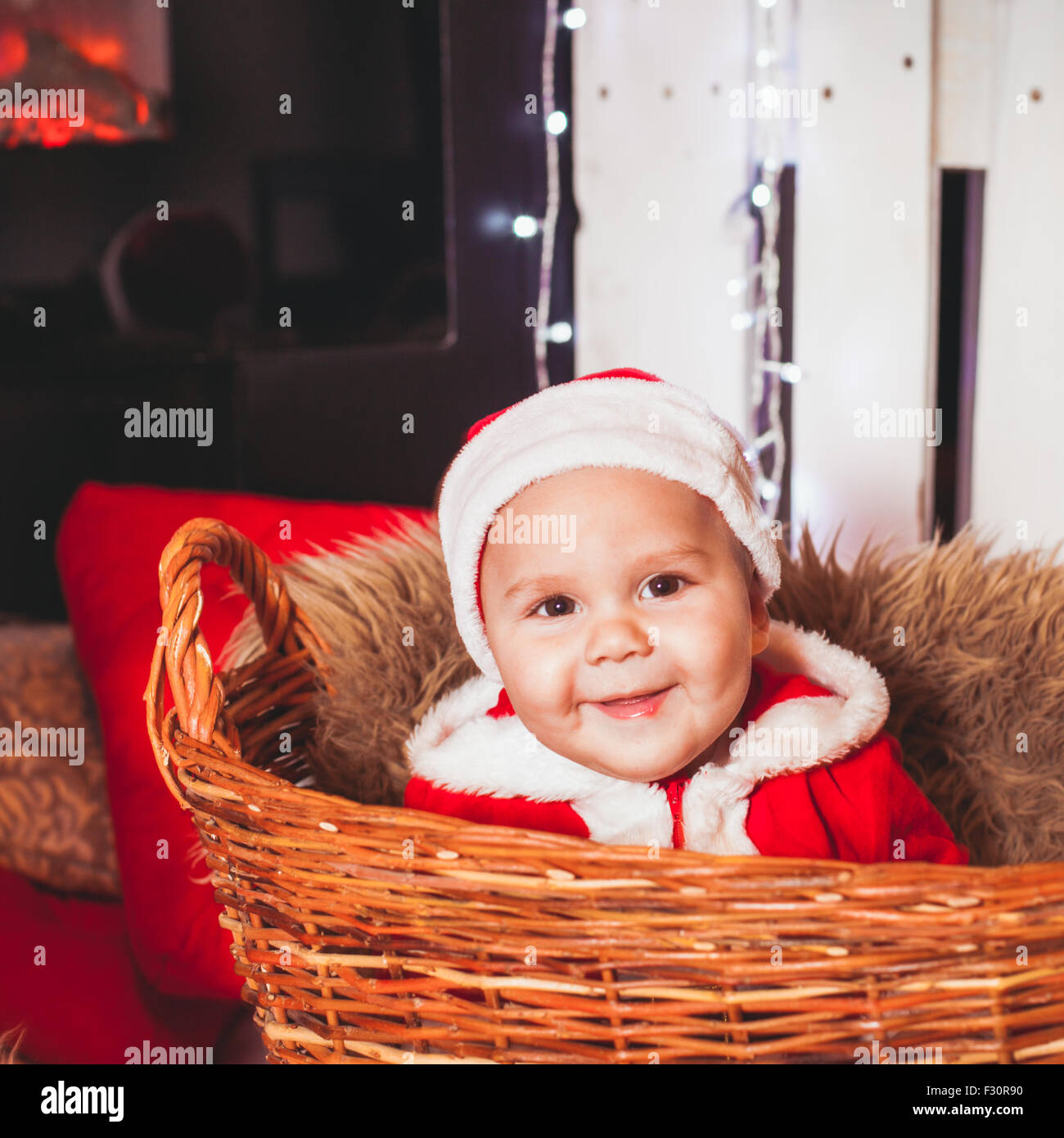 Baby in Santa costume Stock Photo - Alamy