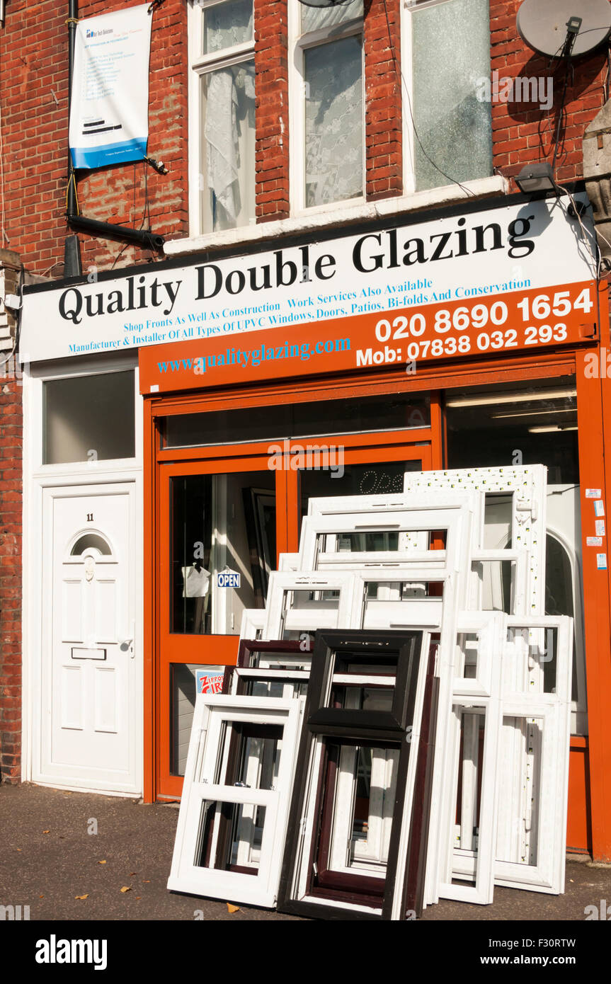 A stack of window frames outside a double glazing shop in Ladywell Road ...