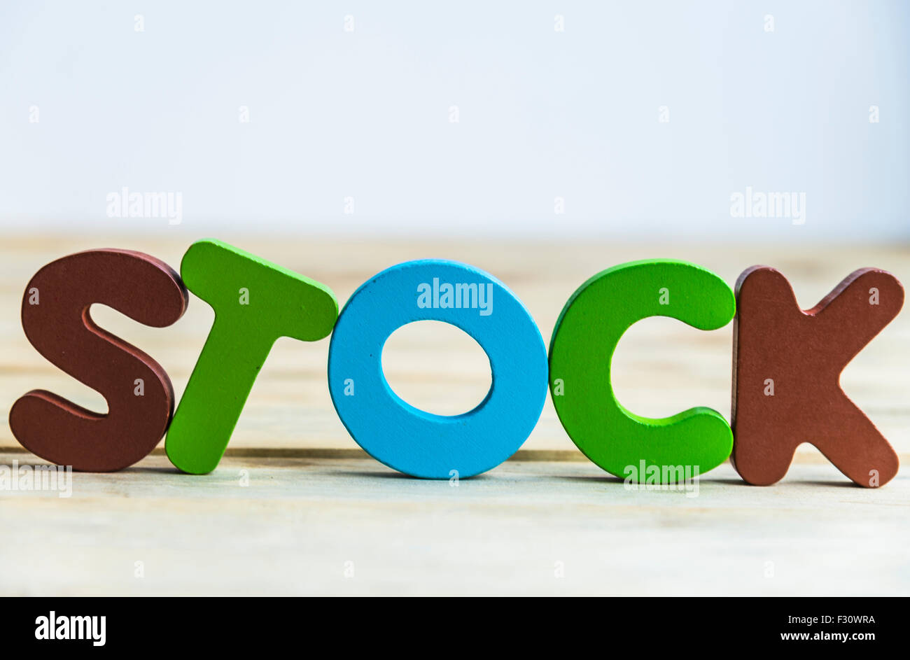 Colorful wooden word Stock on wooden floor Stock Photo - Alamy
