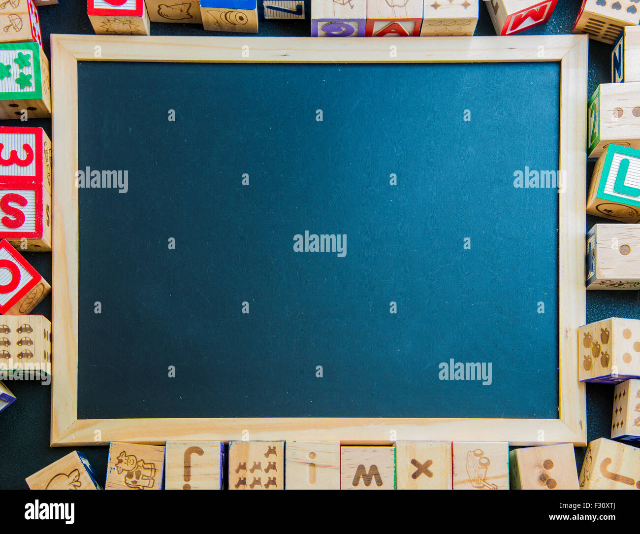 Blank blackboard on wooden block Stock Photo - Alamy