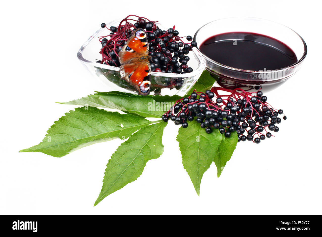 Fruit juice elderberry and butterfly on white isolated background Stock ...
