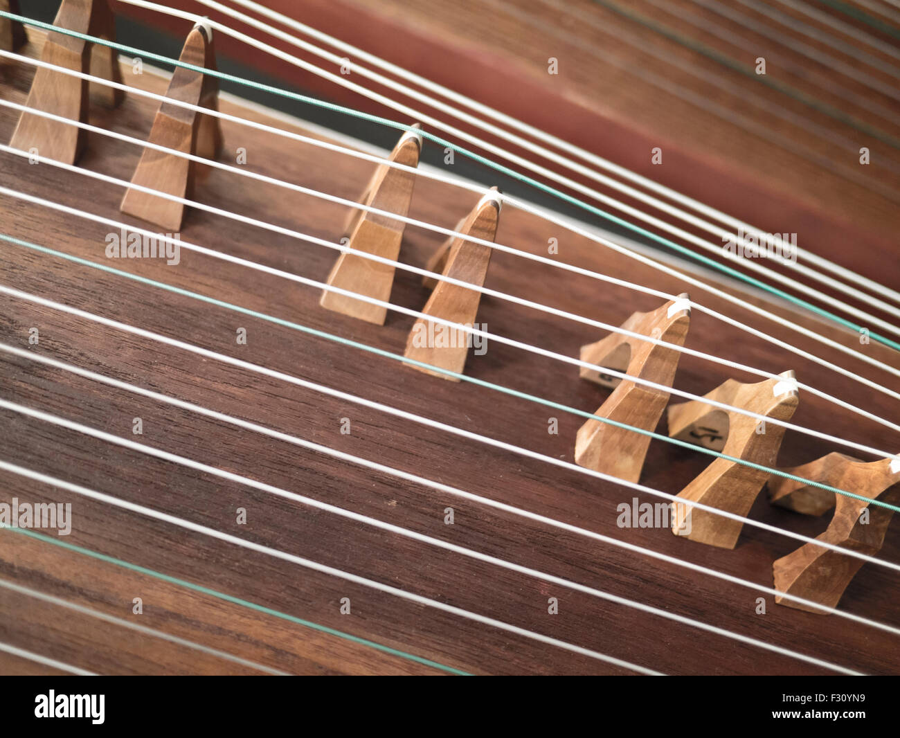 Strings and bridges of Chinese ancient instrument Gu Zheng Stock Photo ...