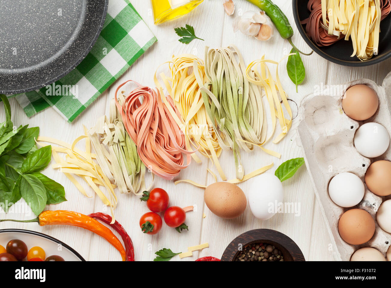 Pasta cooking ingredients and utensils on wooden table. Top view Stock ...