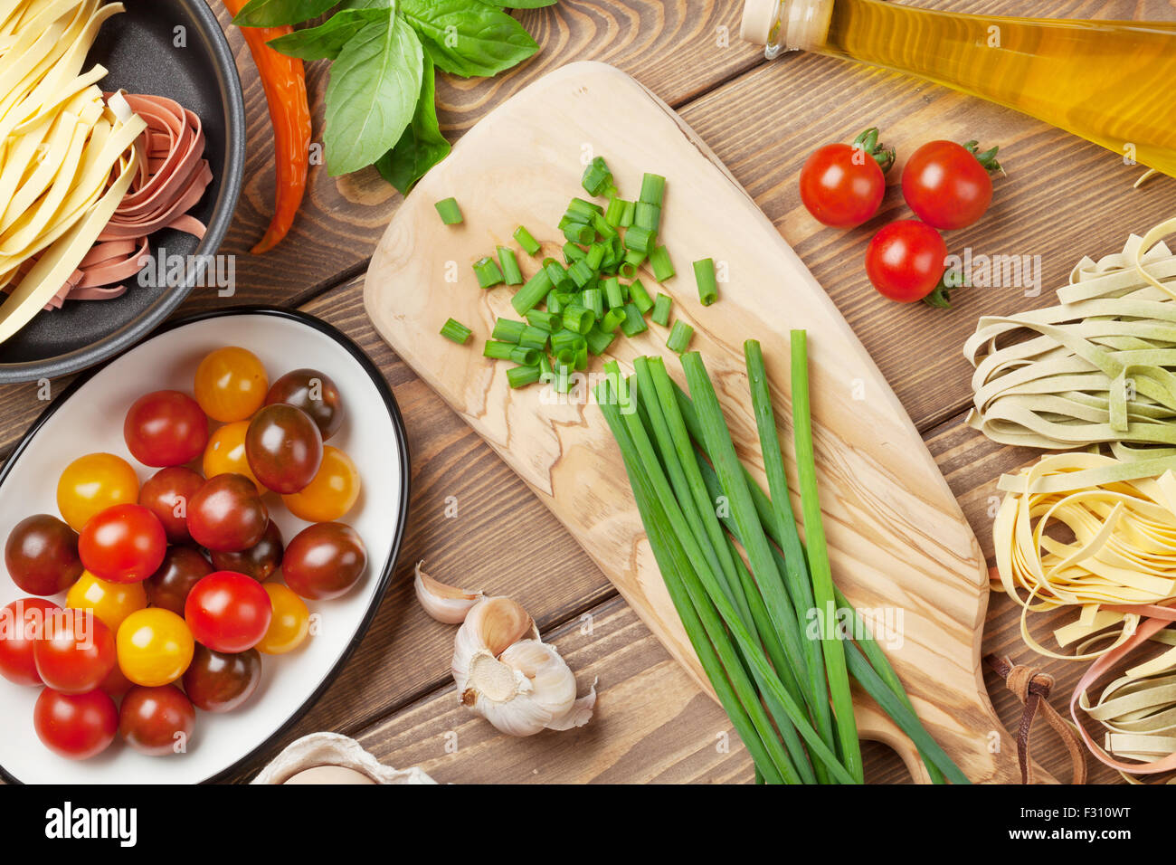 Pasta cooking ingredients and utensils on wooden table. Top view Stock ...
