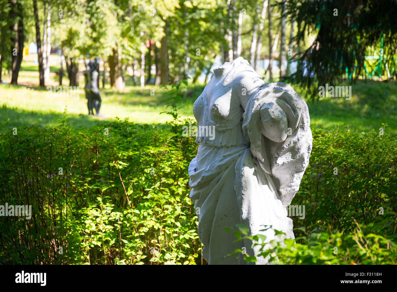 Greek classical style statue in the green summer park Stock Photo - Alamy